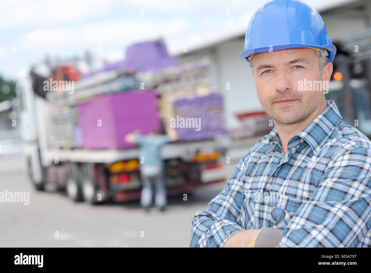 Portrait of man at workplace Stock Photo - Alamy
