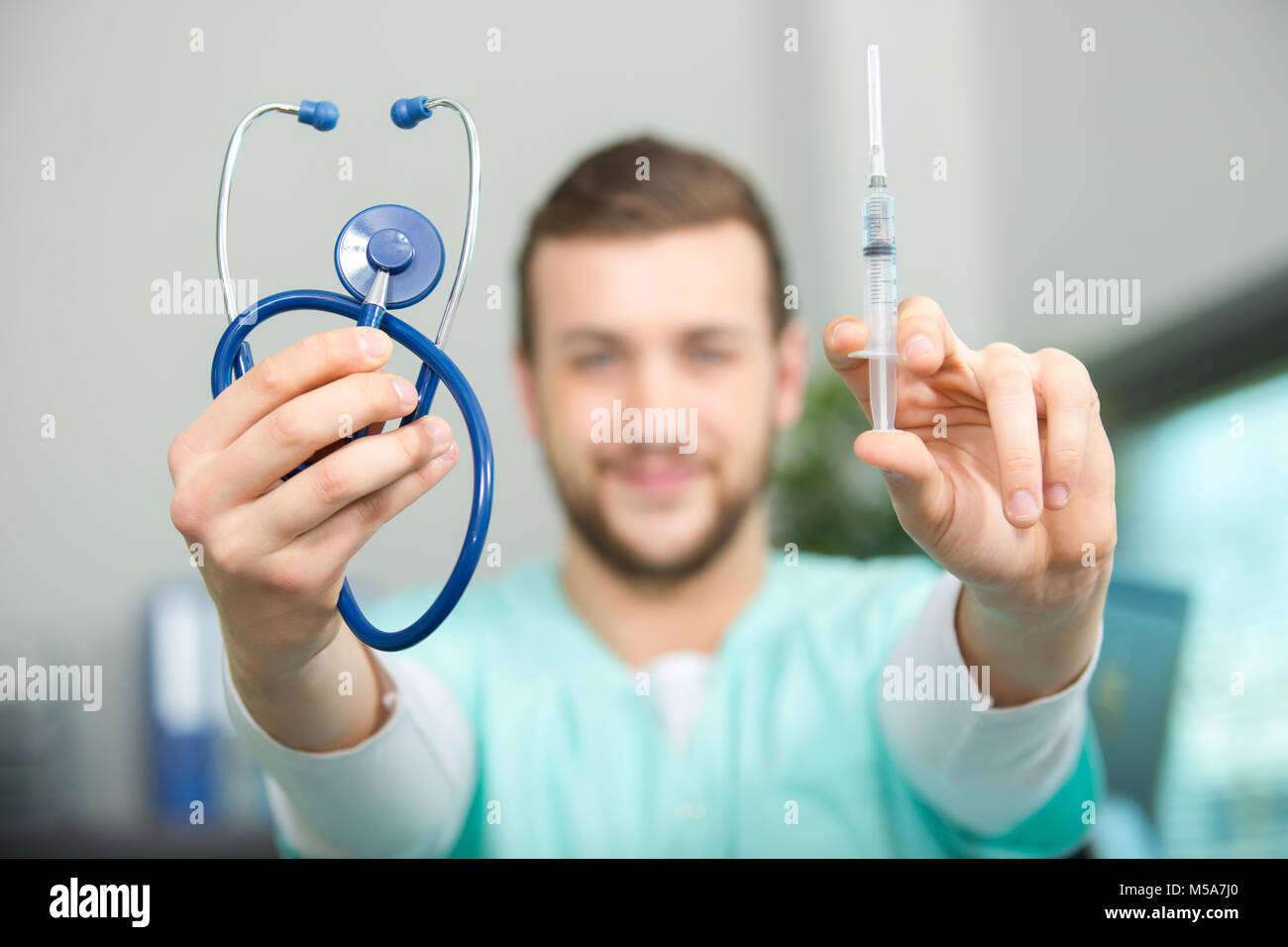 medical doctor or nurse showing an injection Stock Photo - Alamy