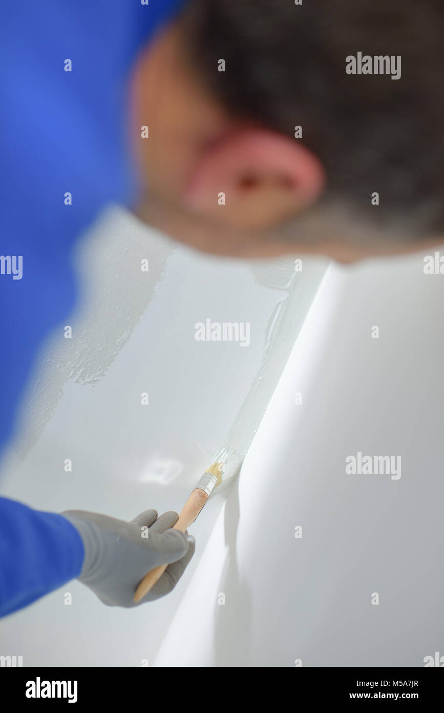Closeup of man painting Stock Photo - Alamy