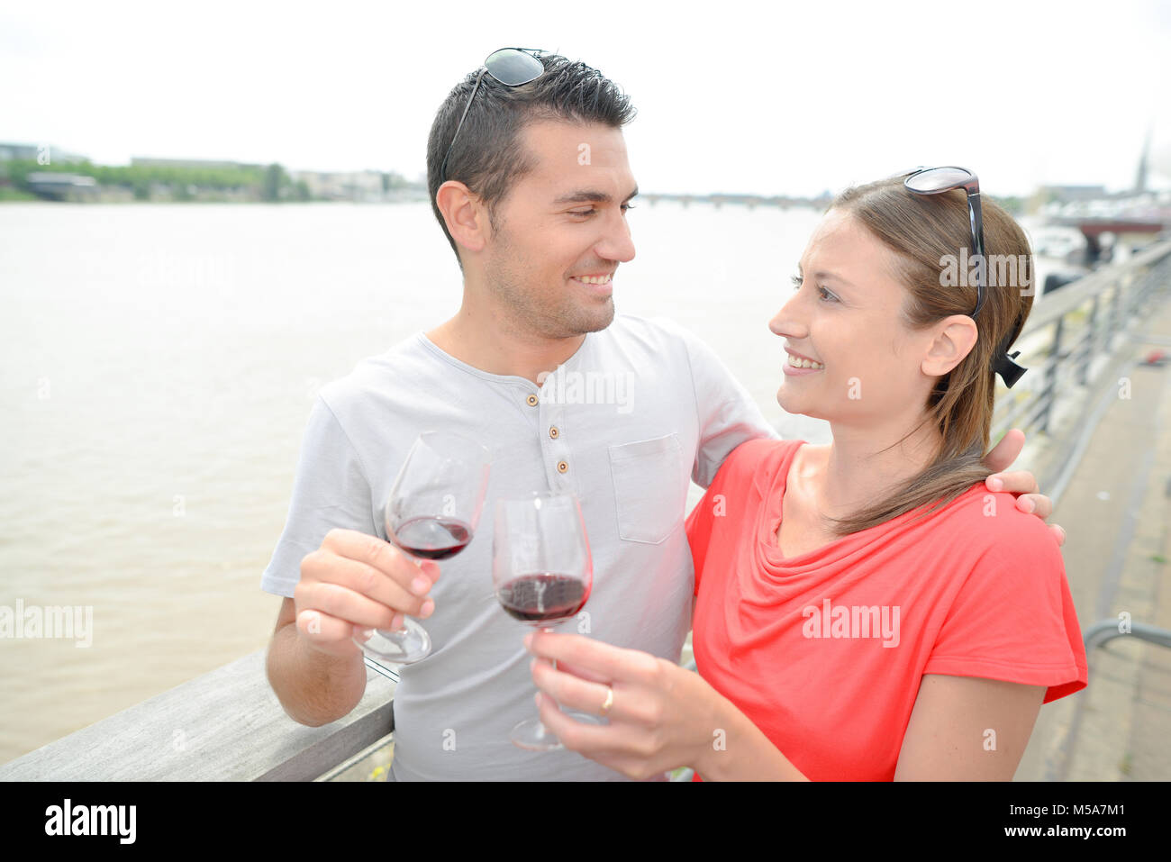 Sharing a glass hi-res stock photography and images - Alamy