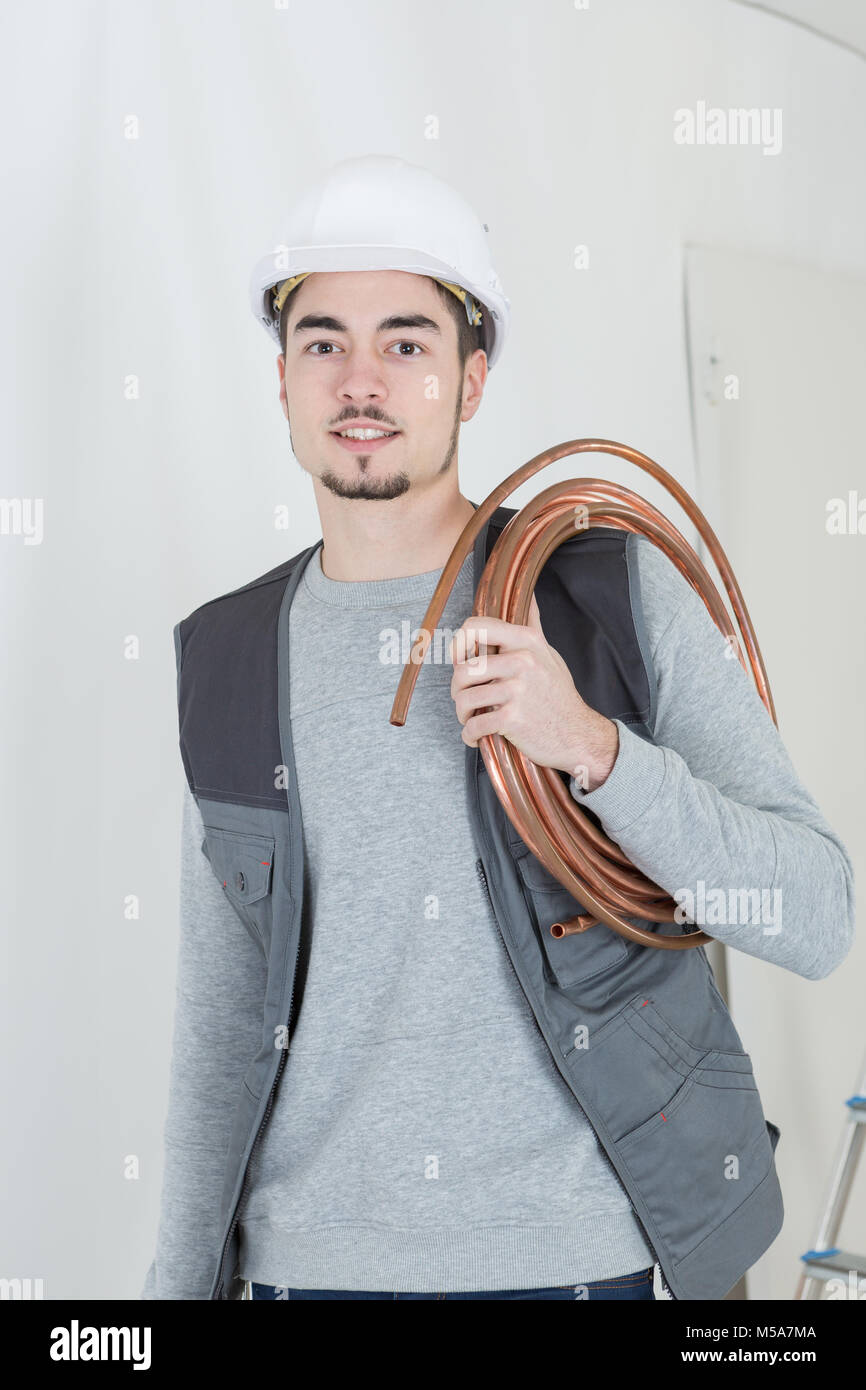 Man holding hose pipe hi-res stock photography and images - Alamy