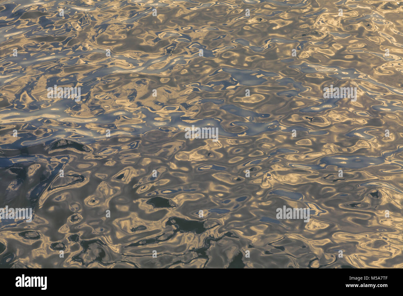 Abstract liquid gold and blue water background Stock Photo - Alamy