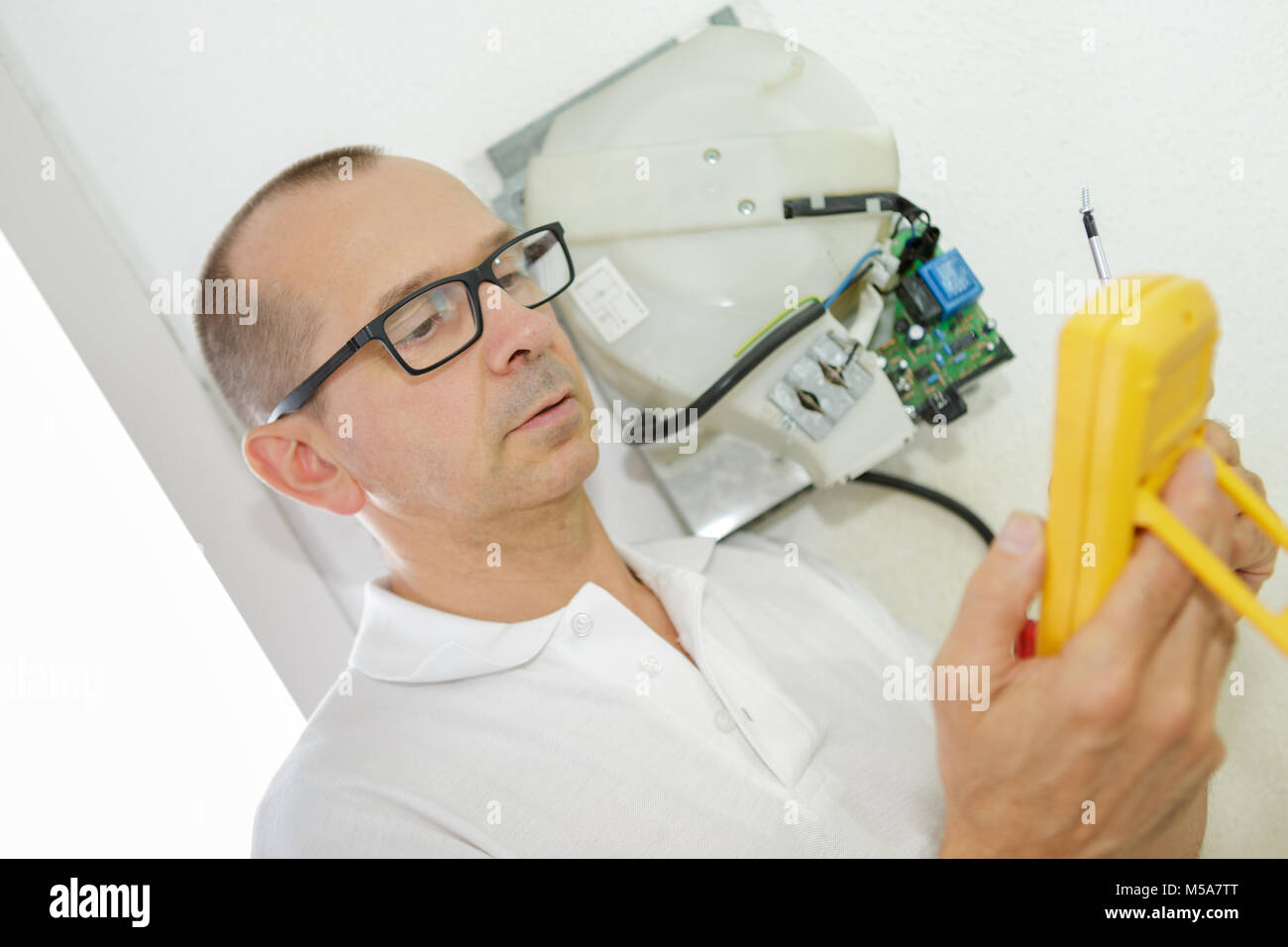 senior technician using multimeter Stock Photo - Alamy