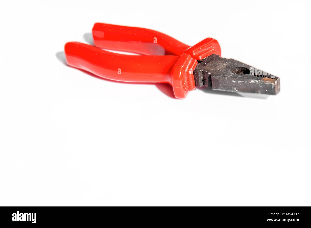 Red grip steel engineer equipment pliers with clipping path for work ...