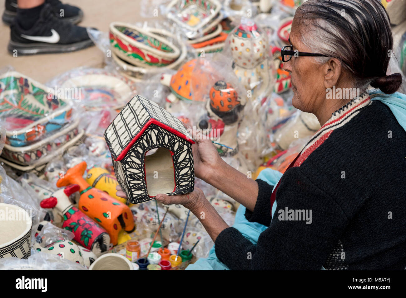 A women selling beautiful hand made decorative items at a shop Stock ...