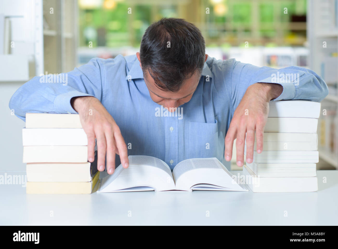 using books for support Stock Photo - Alamy