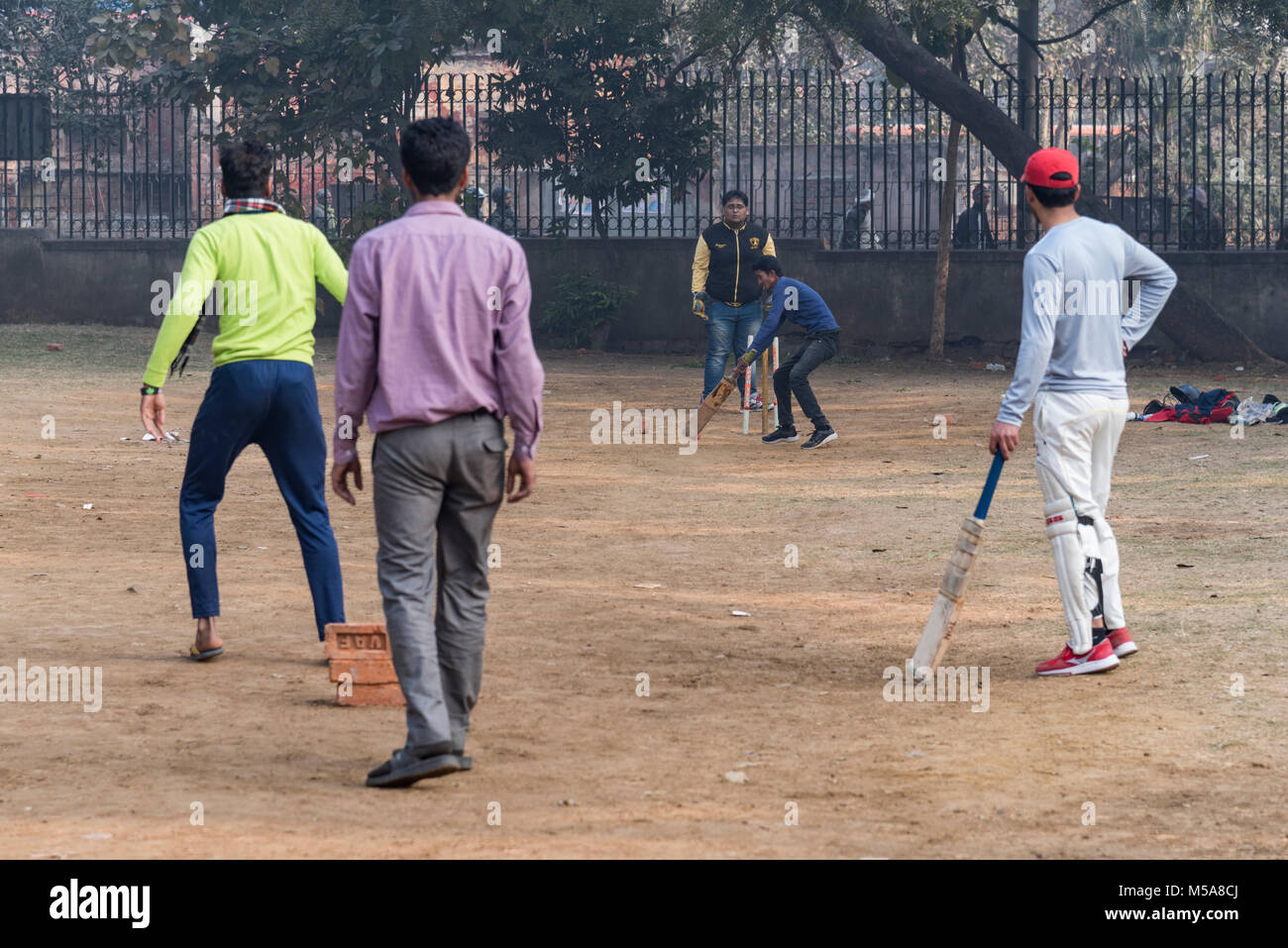 Indian boys playing cricket in hi-res stock photography and images - Alamy