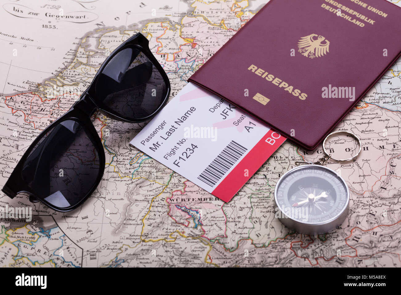 High Angle View Of Boarding Pass Ticket In Passport With Sunglasses And ...