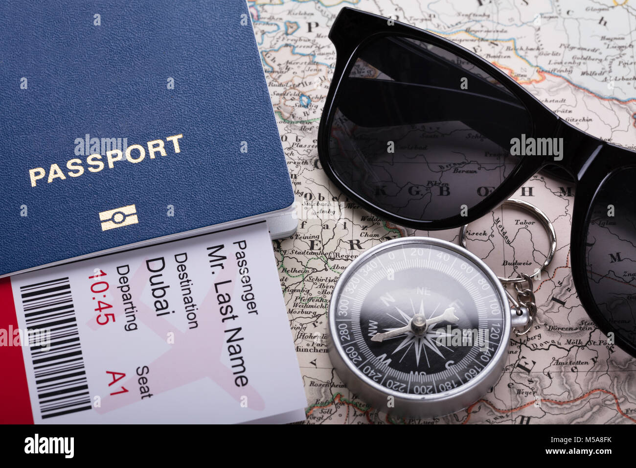 High Angle View Of Boarding Pass Ticket In Passport With Sunglasses And ...