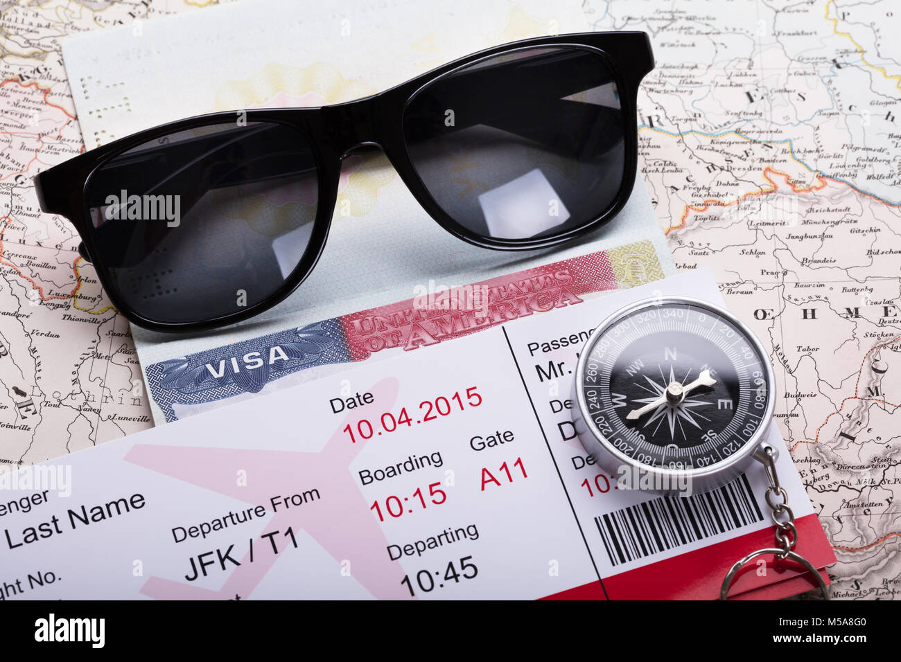 Close-up Of Boarding Pass Ticket, Passport With Sunglasses And Compass ...