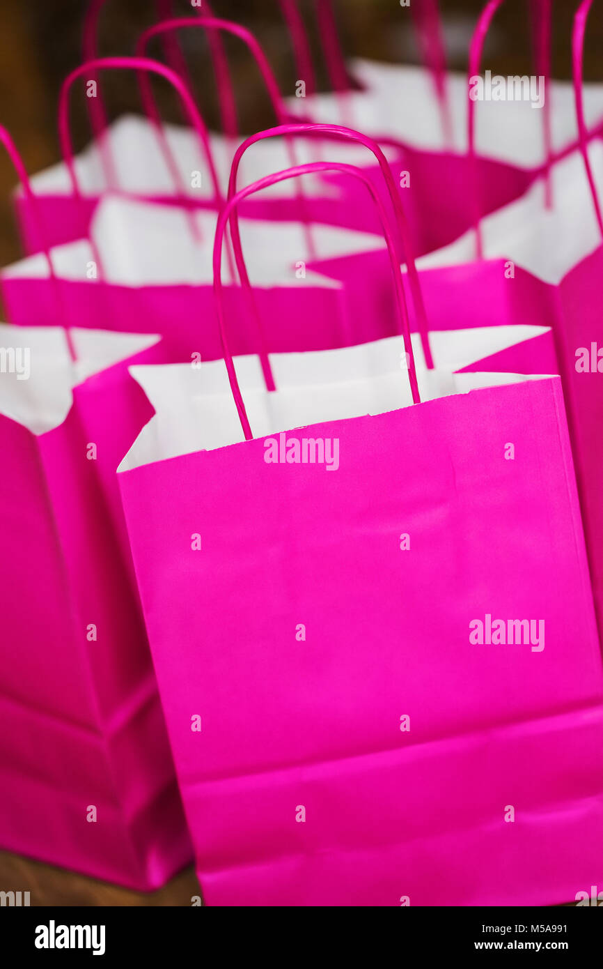 Close up of bright pink paper bags Stock Photo - Alamy