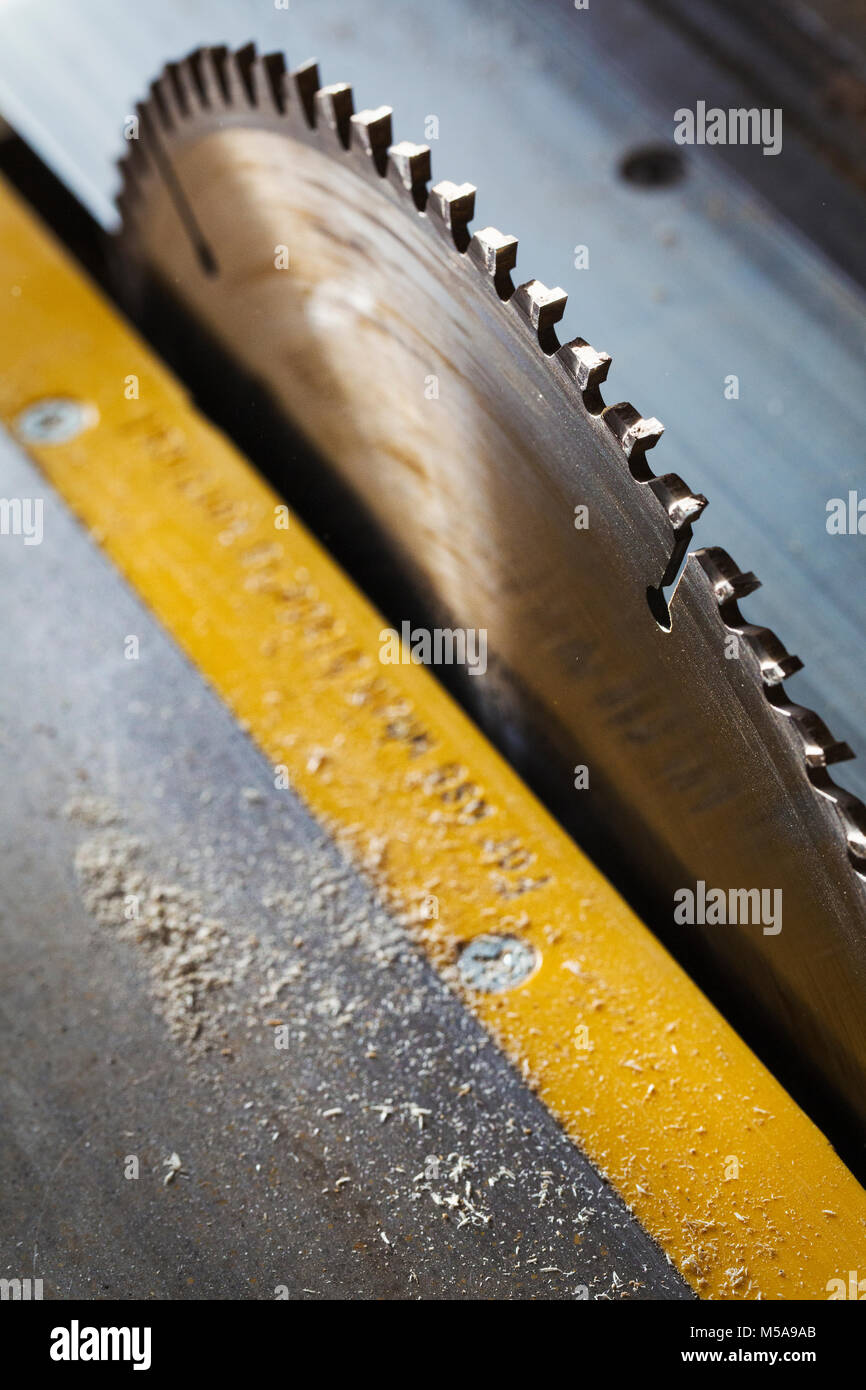 High angle close up of the sharp teeth on teh blade of circular saw in ...