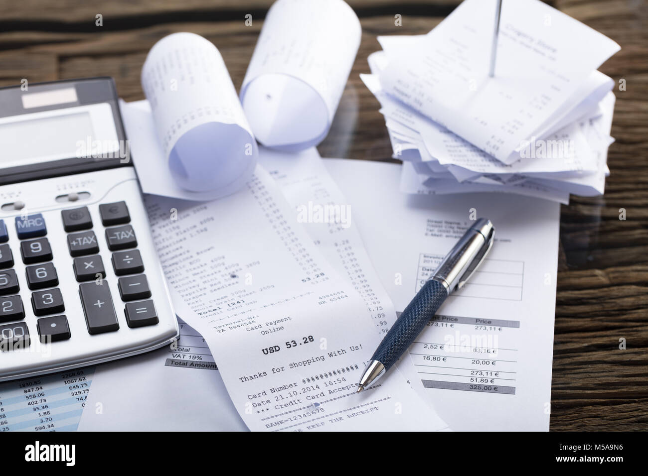 Elevated View Of Calculator And Pen On Receipt In Office Stock Photo ...