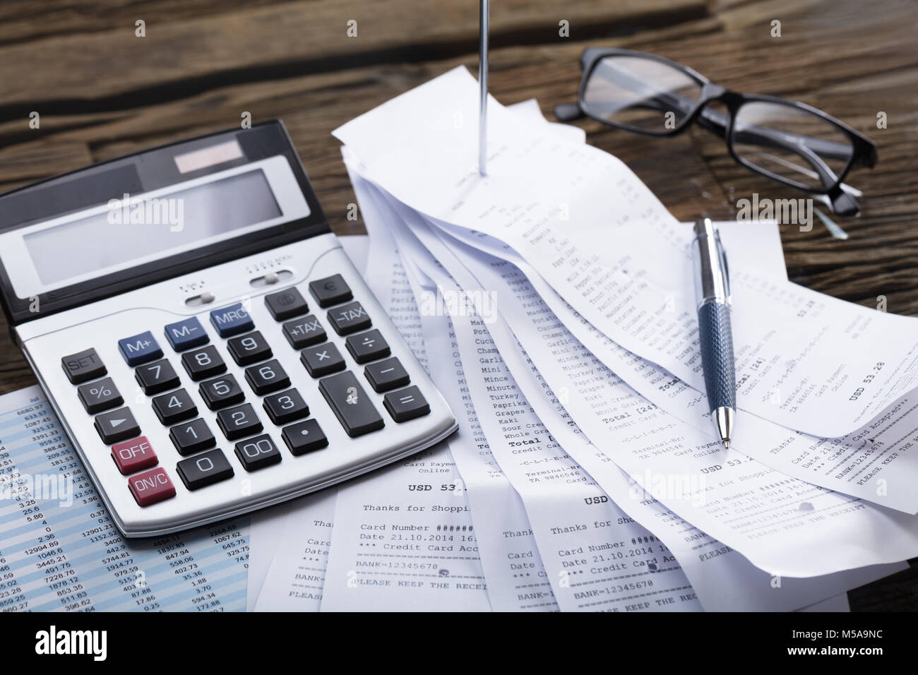 Elevated View Of Calculator And Pen On Receipt In Office Stock Photo ...