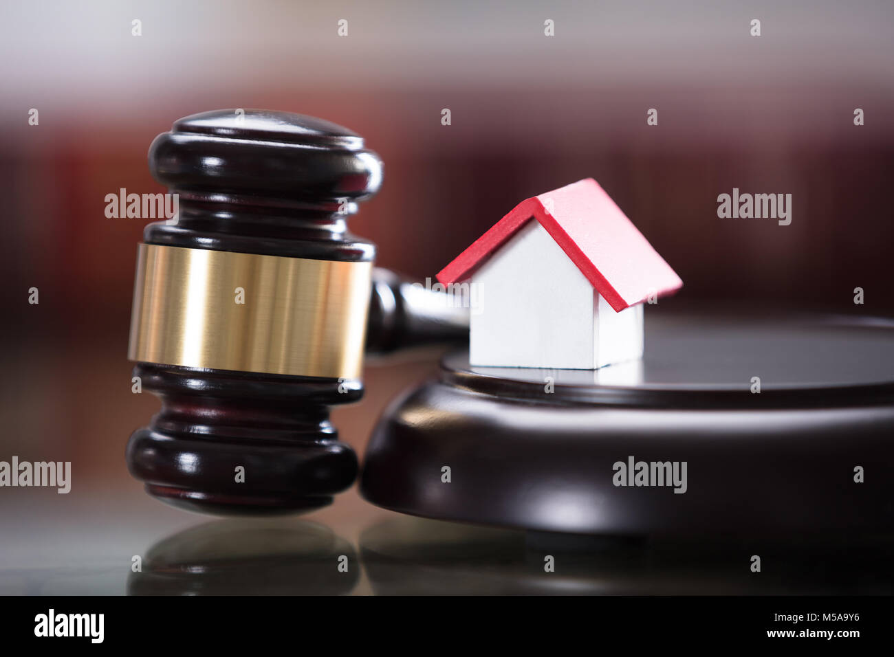Close-up Of Gavel With Small House Model In Courtroom Stock Photo - Alamy