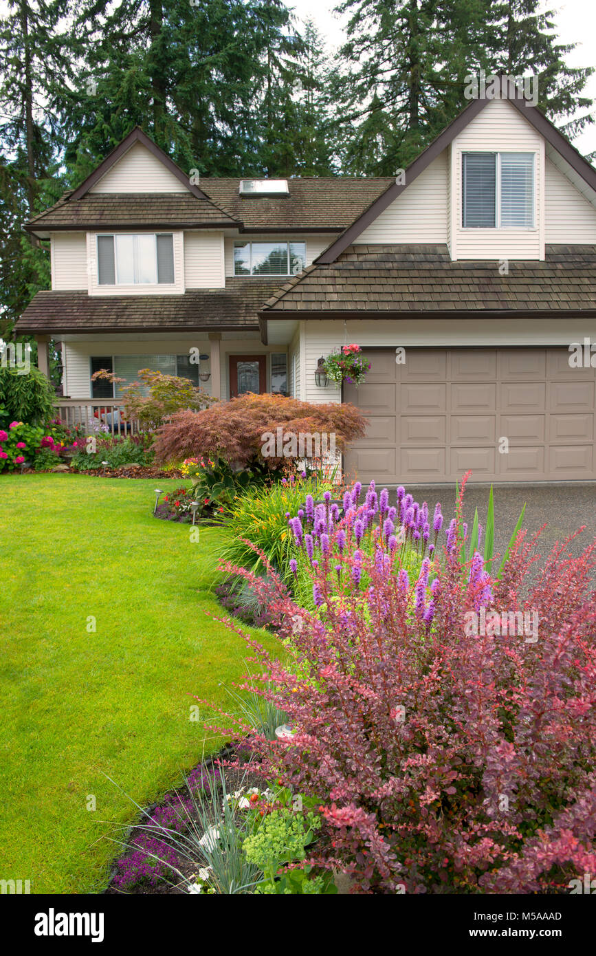 Beautiful home and garden in backyard setting Stock Photo - Alamy