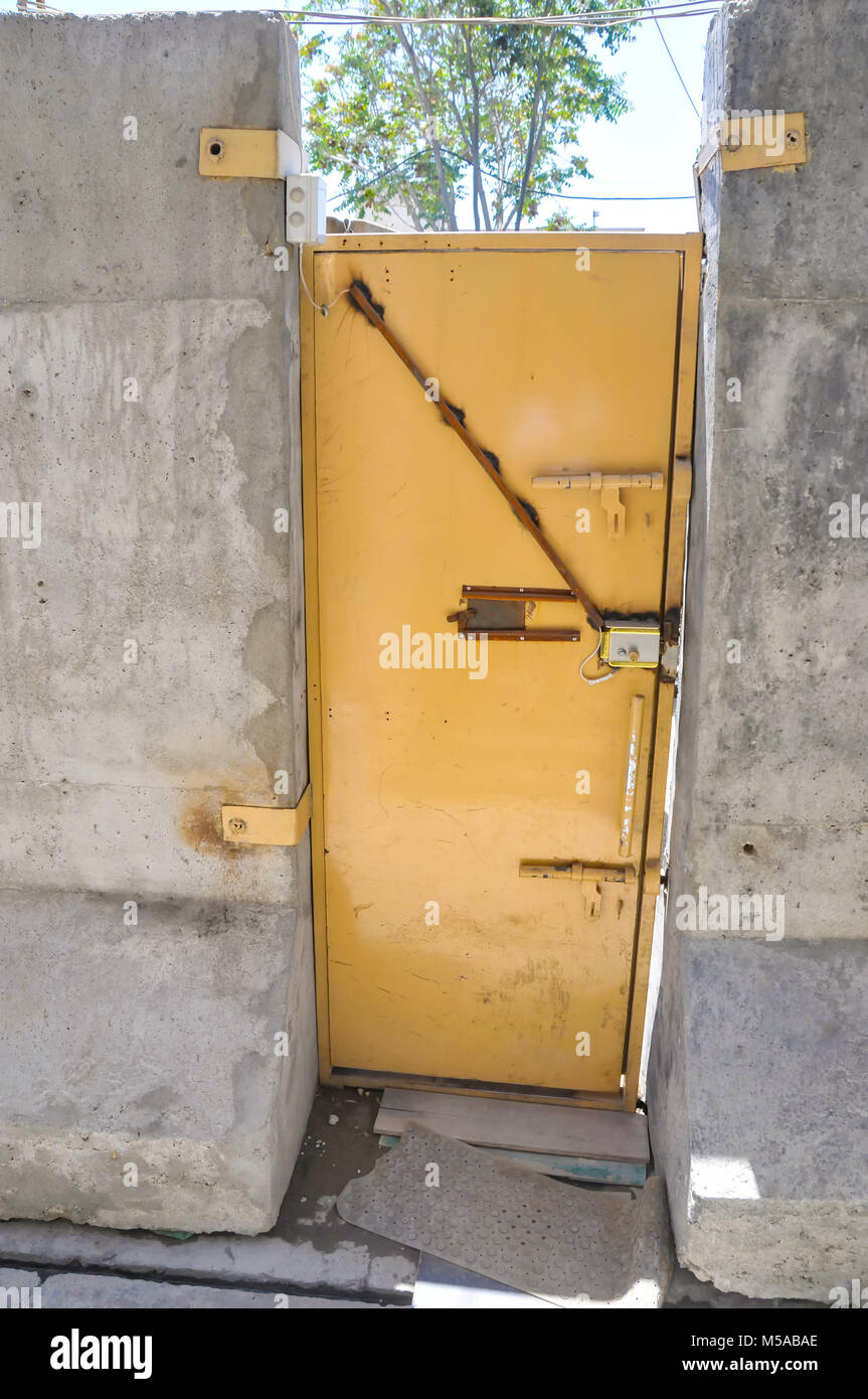 T-wall concrete sections and a security door in Afghanistan protecting ...