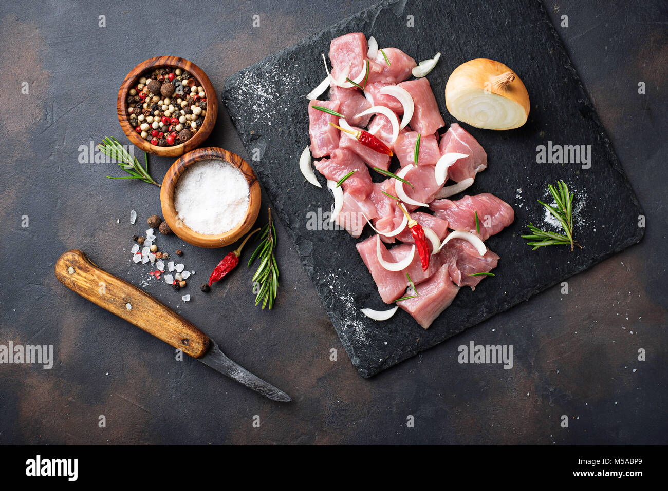 Raw chopped meat with spices on rusty background Stock Photo - Alamy