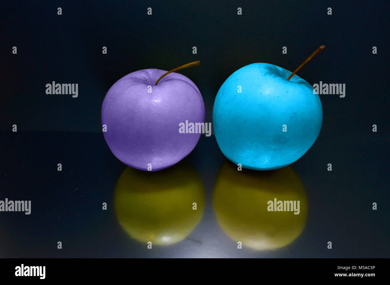 swap color apples, lilac and baby blue Stock Photo - Alamy