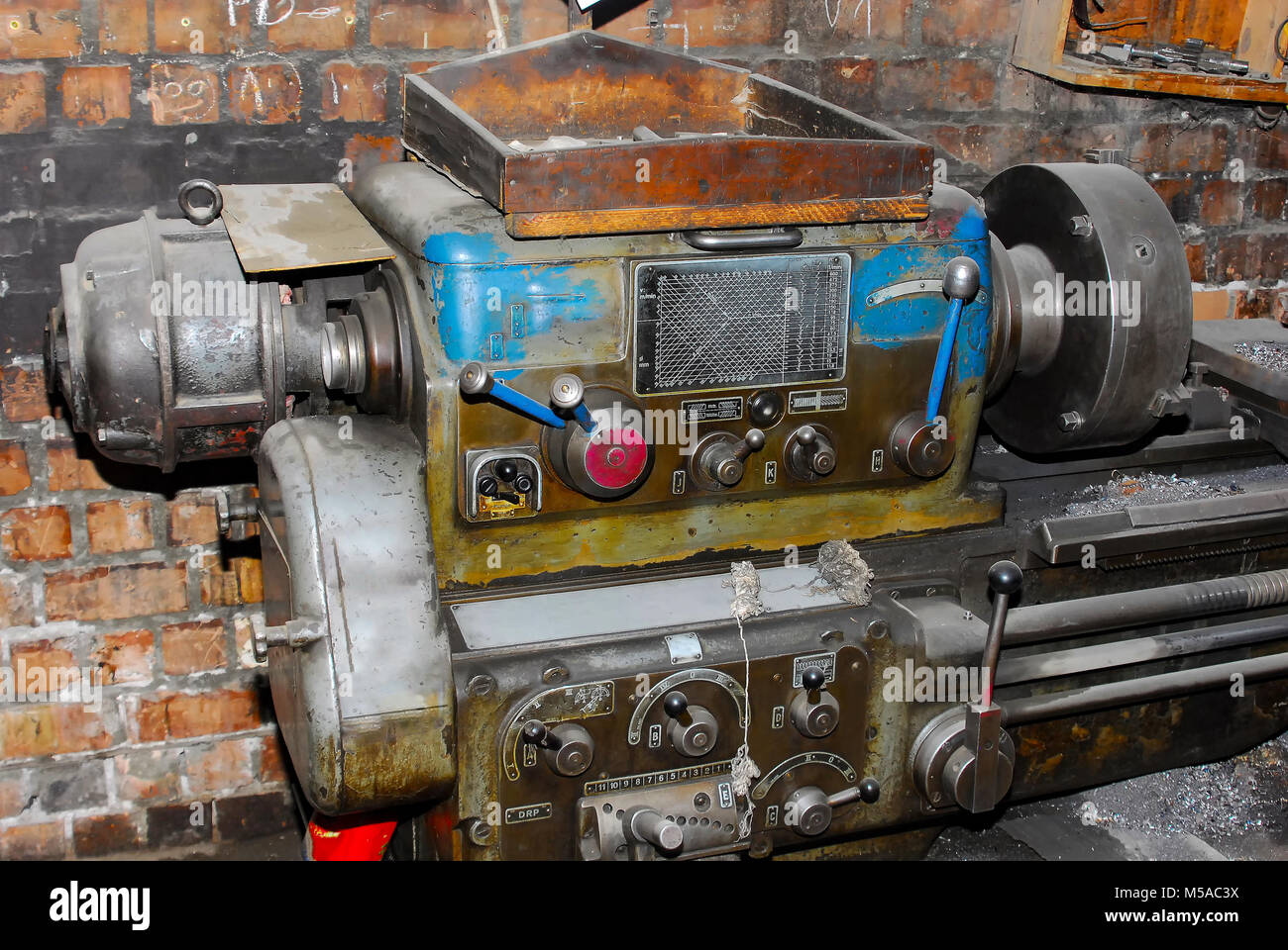 A vintage metalworking lathe machine in an old metal workshop Stock ...