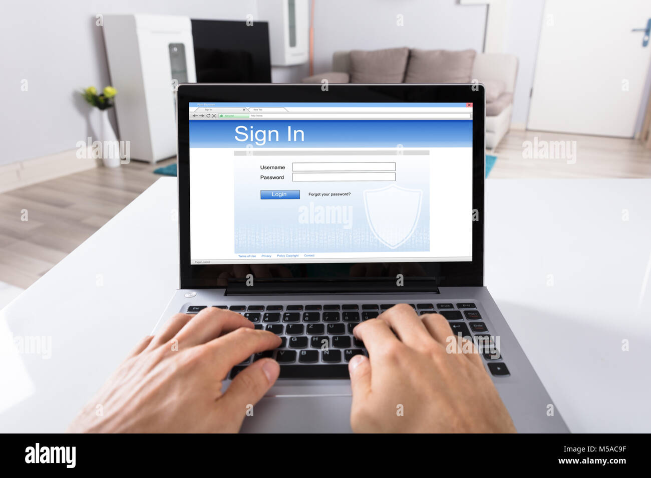 Close-up Of A Person's Hand Signing Into Website On Laptop Stock Photo ...