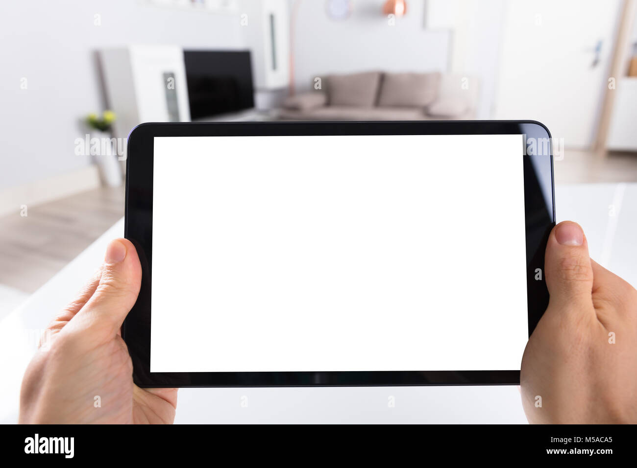 Human Hand Using Digital Tablet With Blank White Screen Stock Photo - Alamy
