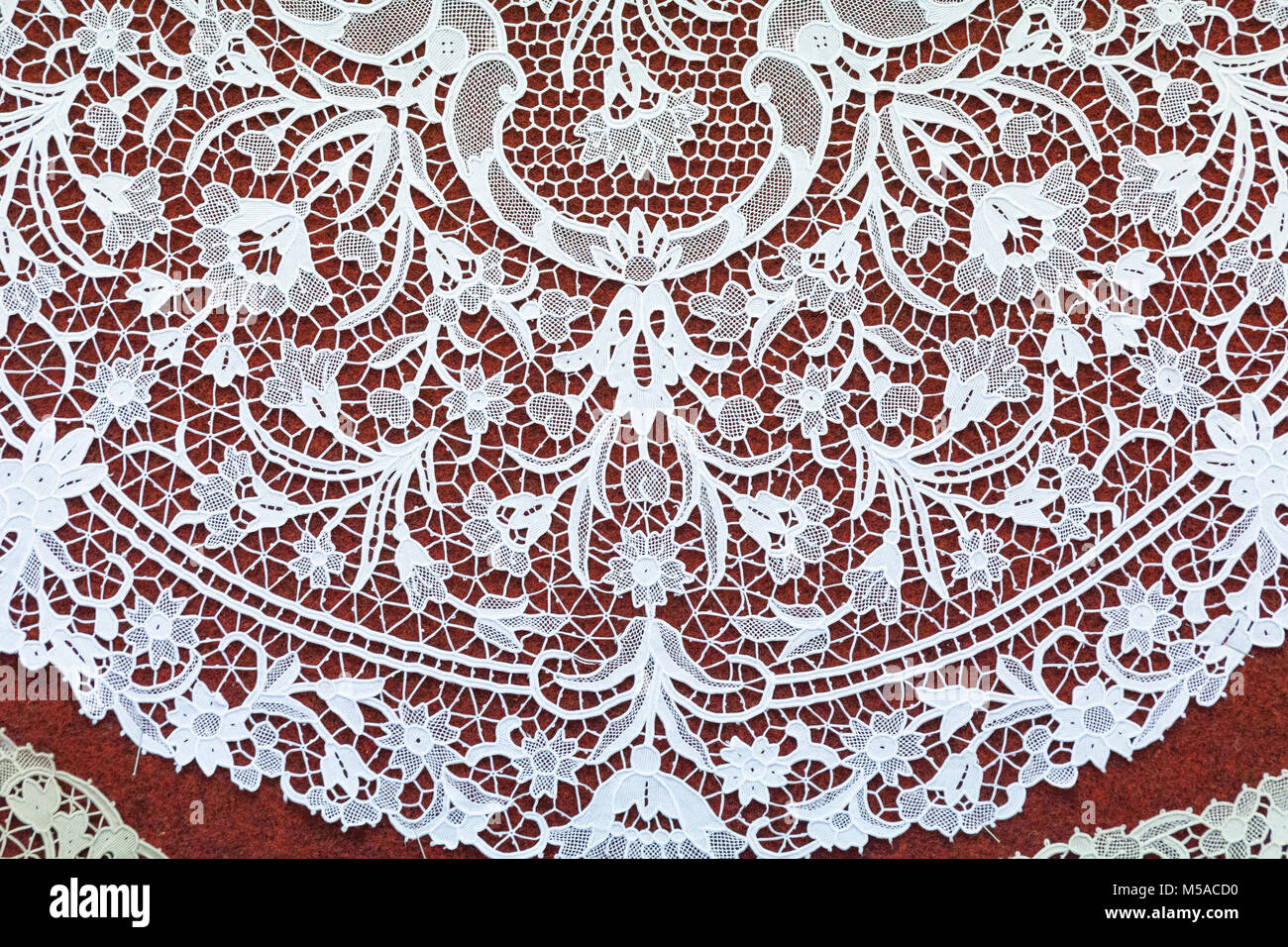 Detail of an intricate round handmade Burano lace tablecloth on Burano ...