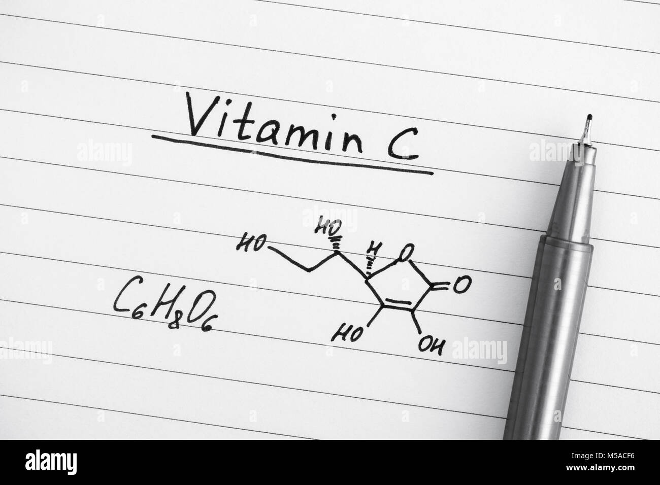 Chemical formula of Vitamin C with pen. Close-up Stock Photo - Alamy