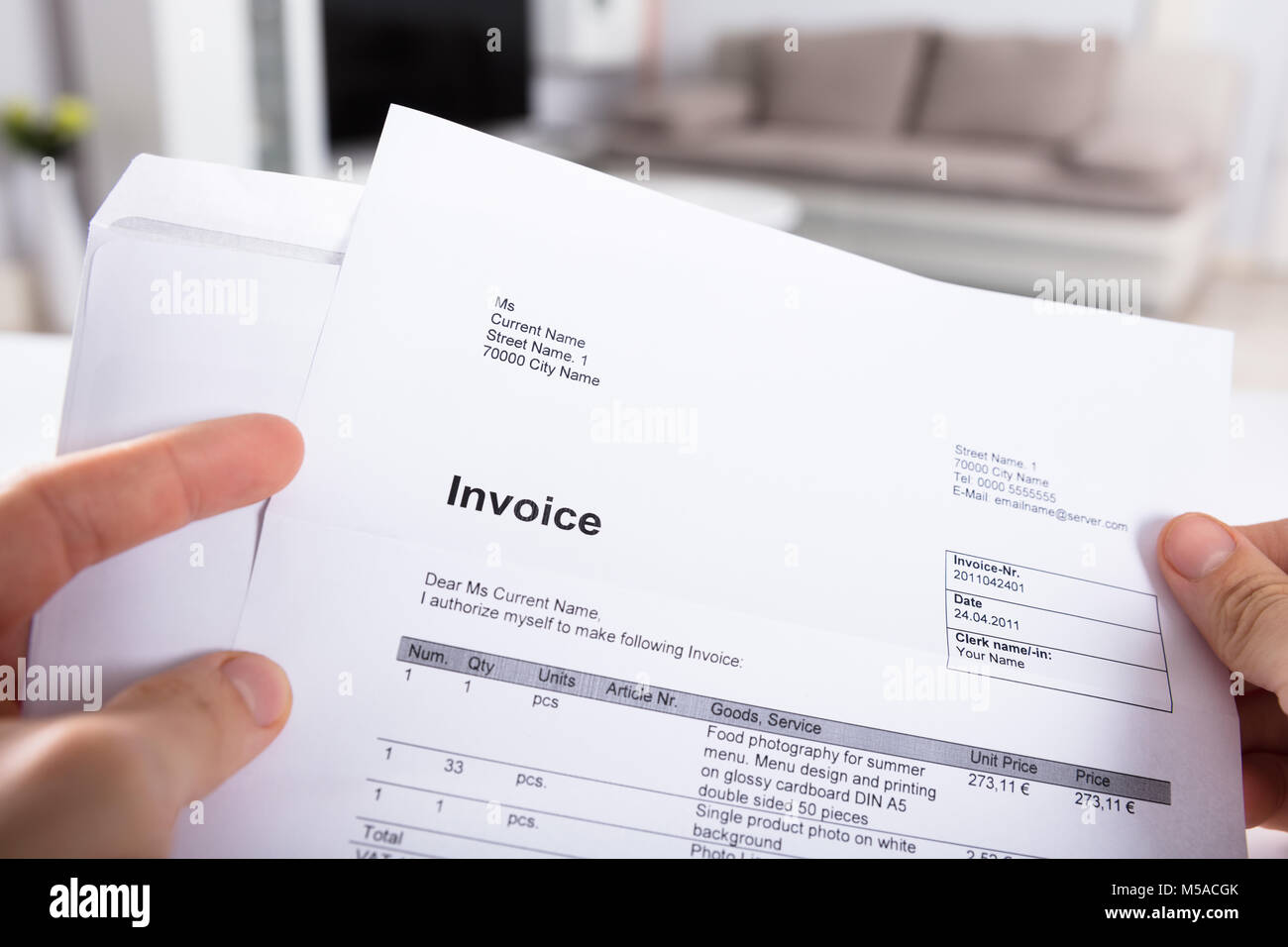 Close-up Of A Person's Hand Holding Invoice Stock Photo - Alamy