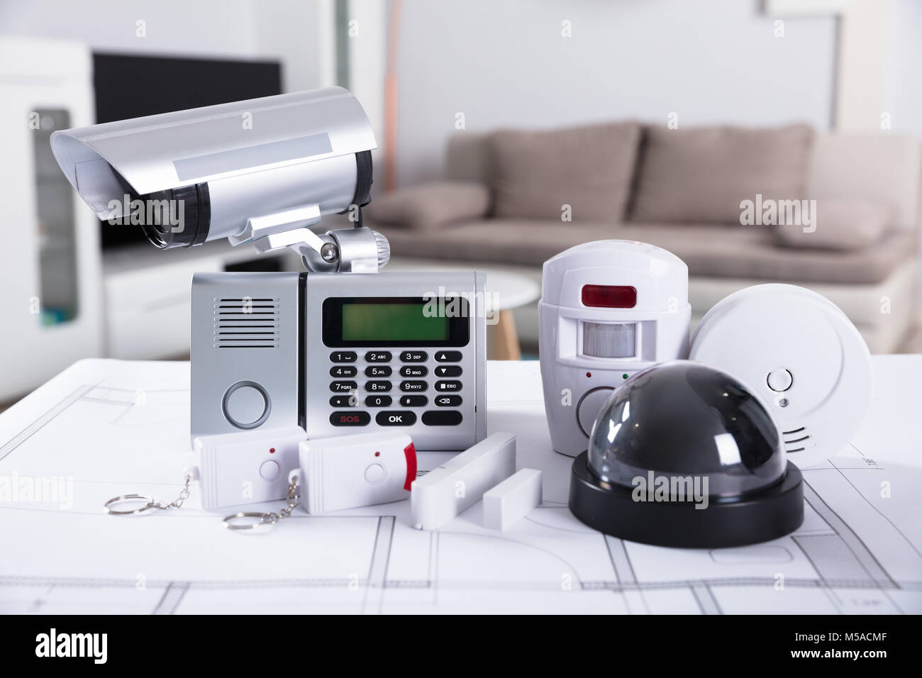 Close-up Of Home Security Equipment On Blueprint Stock Photo - Alamy