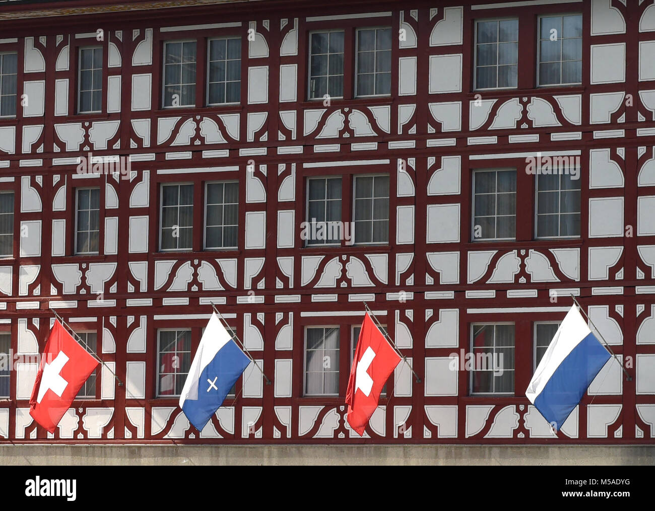 Swiss Flag and Flag of Lucerne on the facade building in Lucerne ...