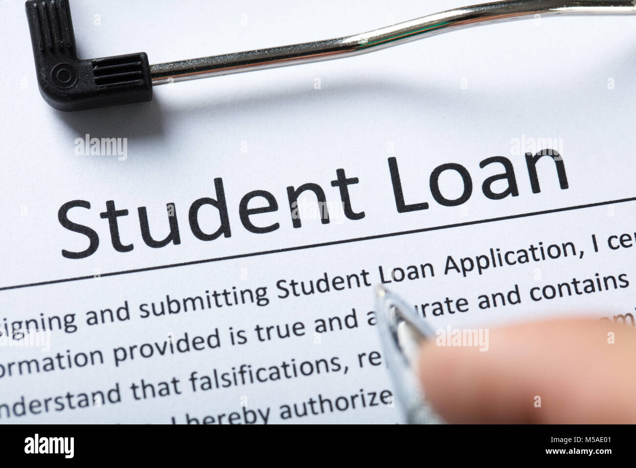 Education Loan application form with a pen and pencil Stock Photo - Alamy