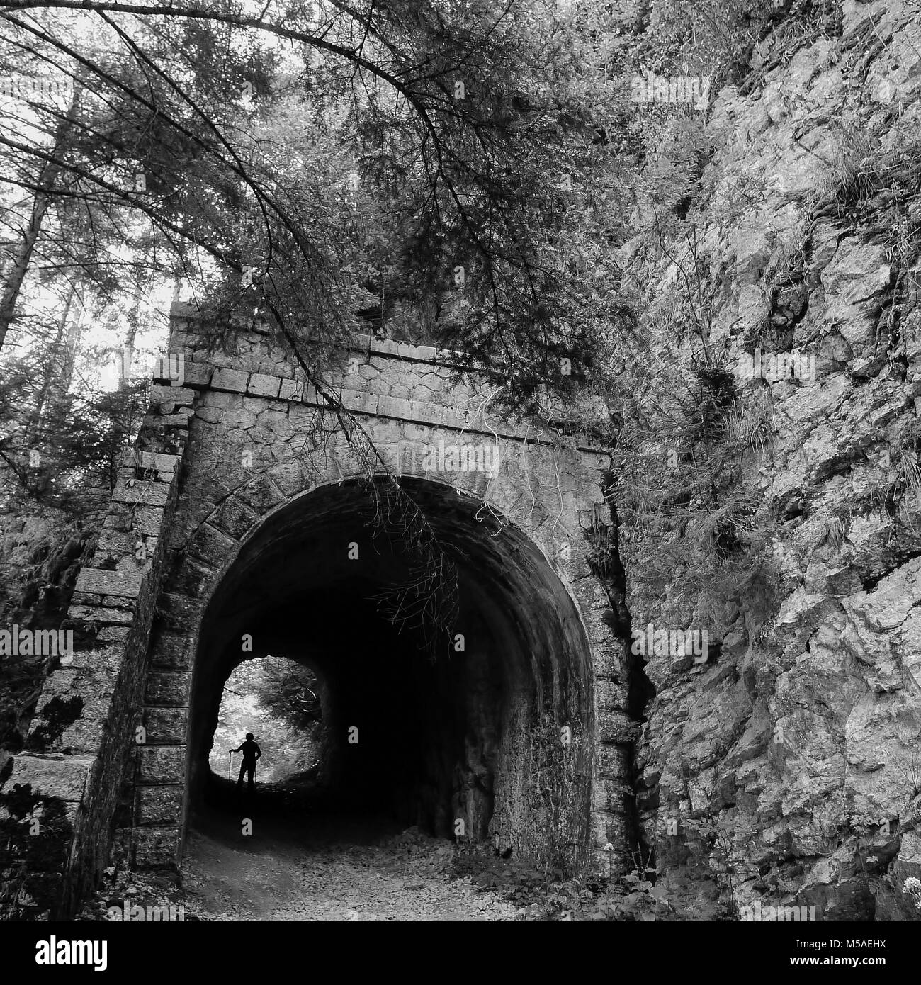 Walking through a tunnel on the footpath to Mount Revard, Savoy, France ...