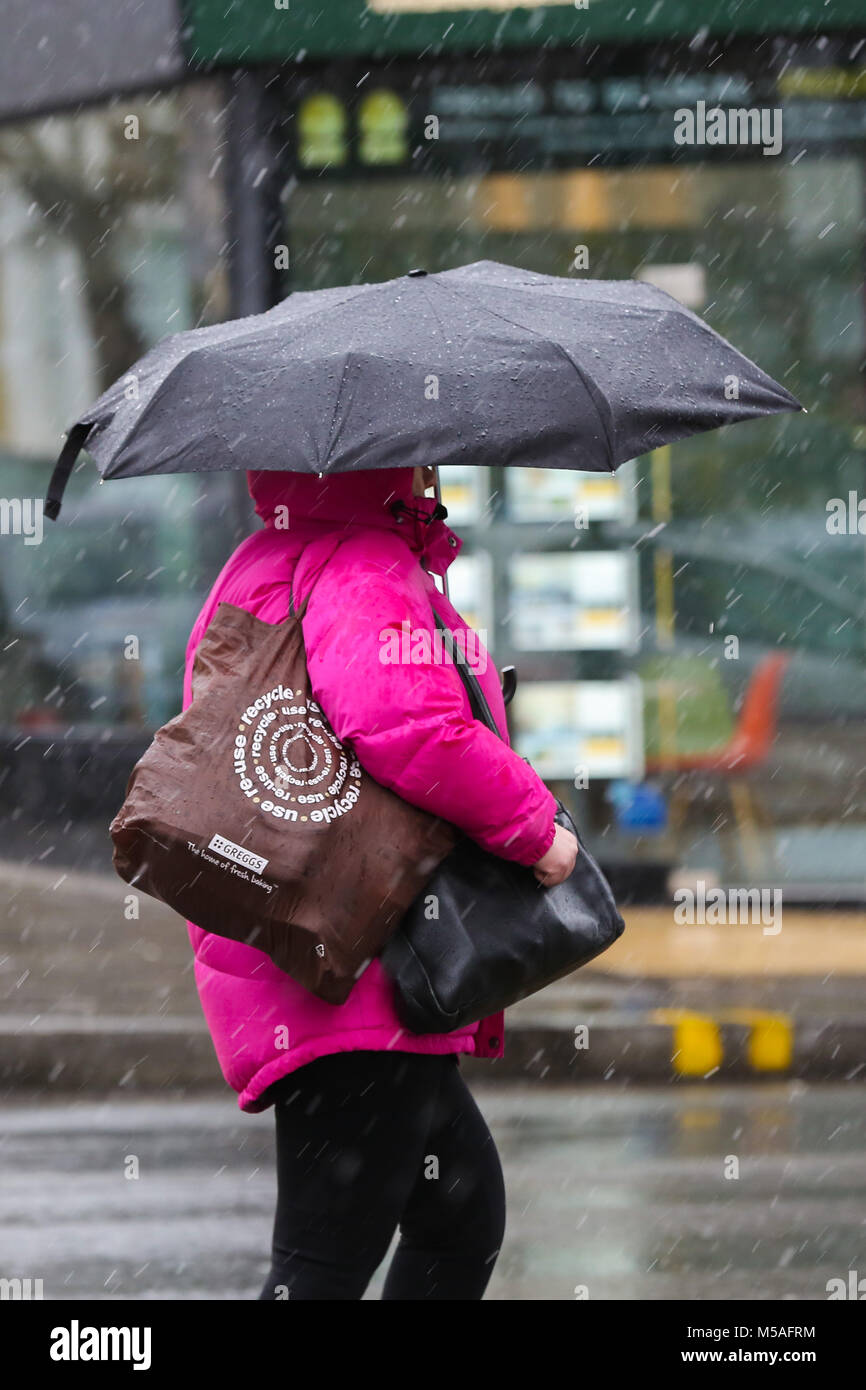 People out and about as light snow and sleet falls in London Featuring ...