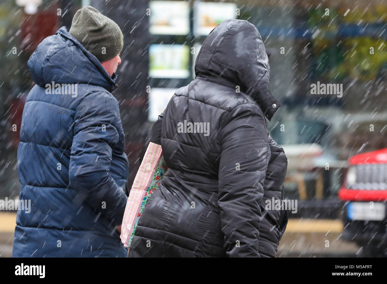 People out and about as light snow and sleet falls in London Featuring ...