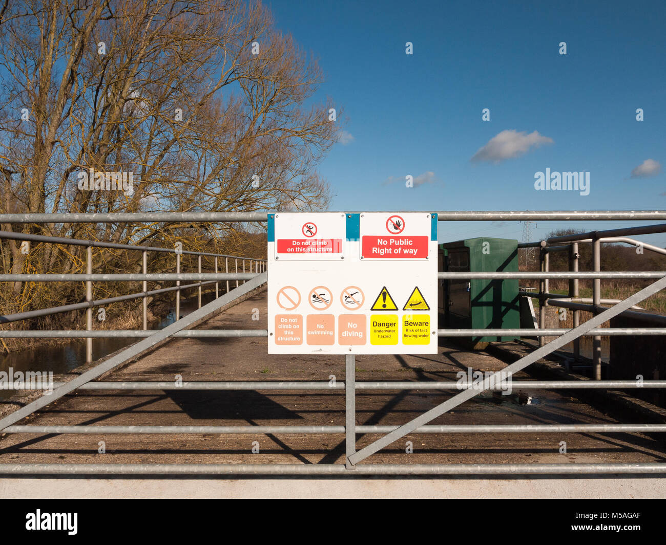 safety nature sign on locked metal gate do not climb this structure no ...