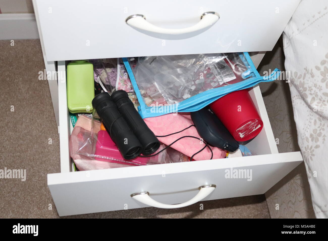 Bedroom drawers full of items messy Stock Photo - Alamy