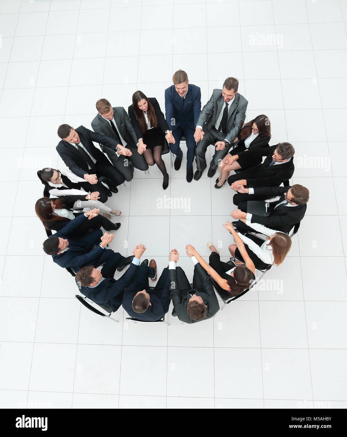 concept of team building.large business team sitting in a circle Stock ...