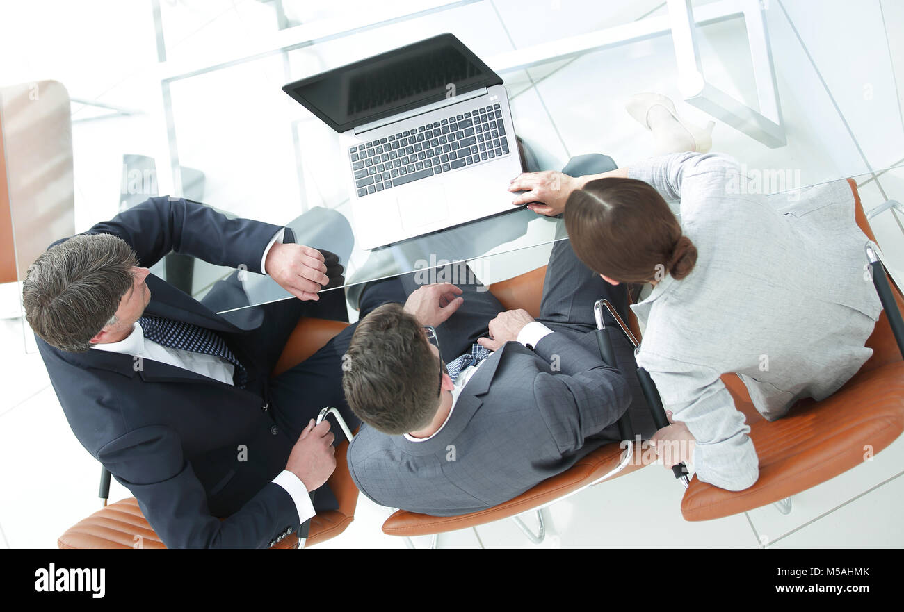 Businessman sitting around boardroom table hi-res stock photography and ...