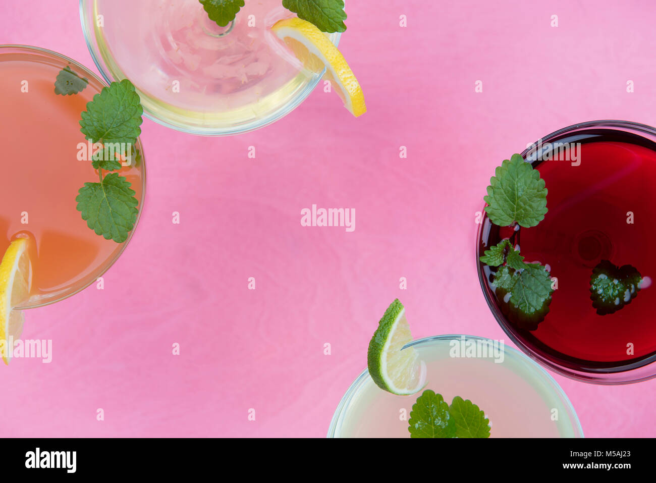 colorful drinks on a pink background Stock Photo - Alamy