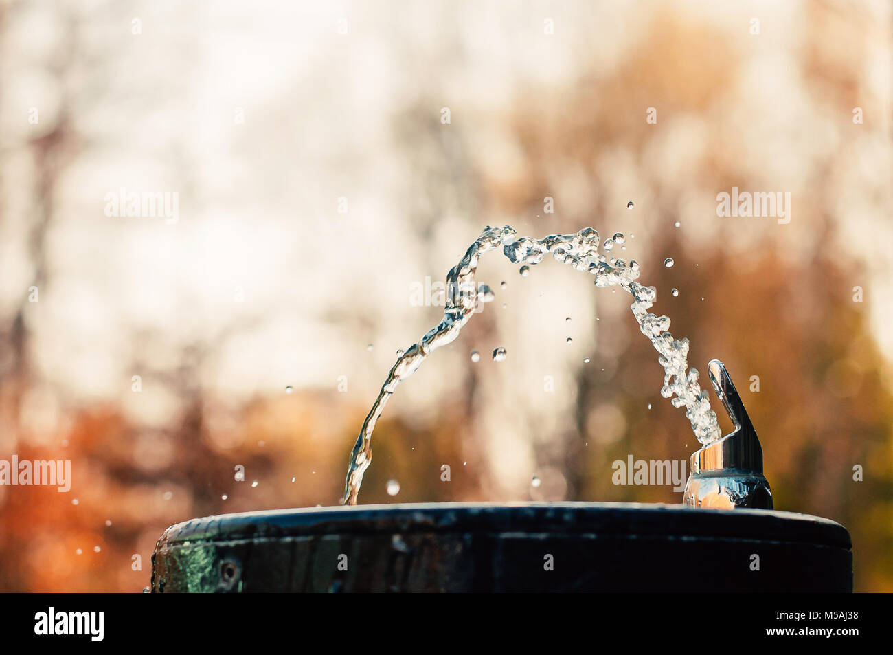 Water Pouring from Drinking Fountain Stock Photo - Alamy