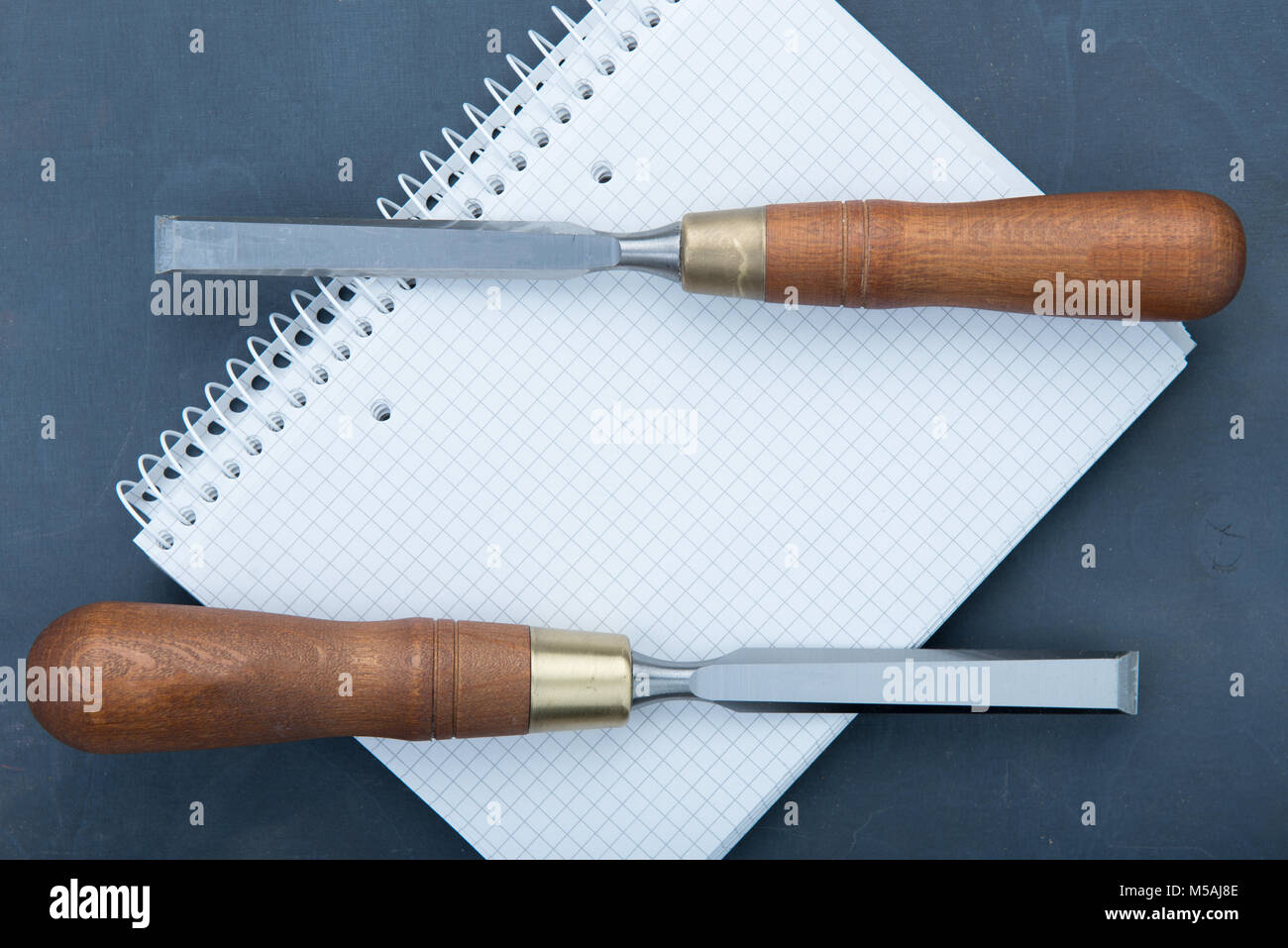 A professional chisel on a wooden background, with room for text Stock ...