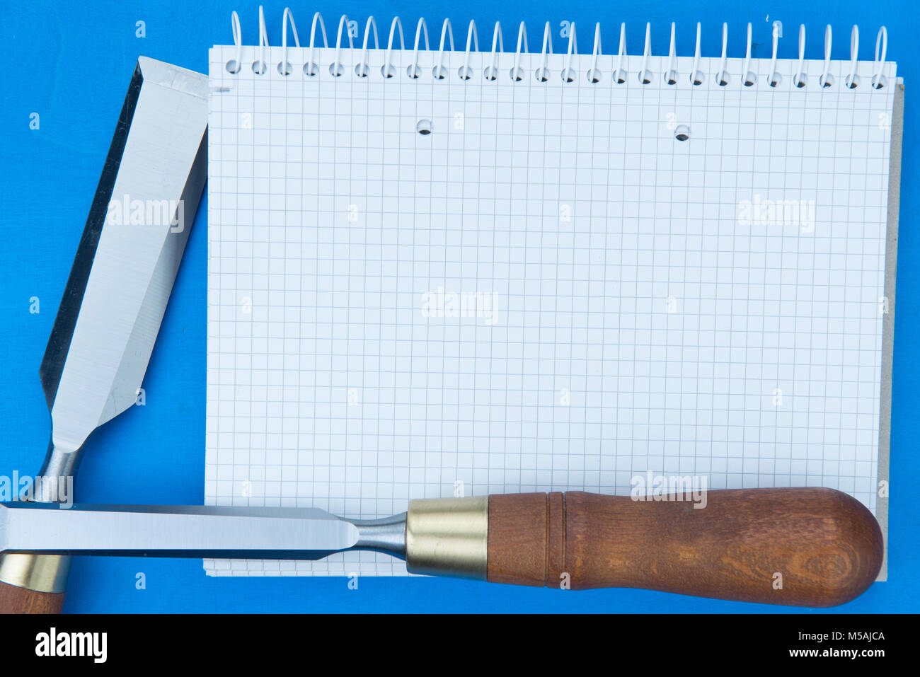 A professional chisel on a wooden background, with room for text Stock ...