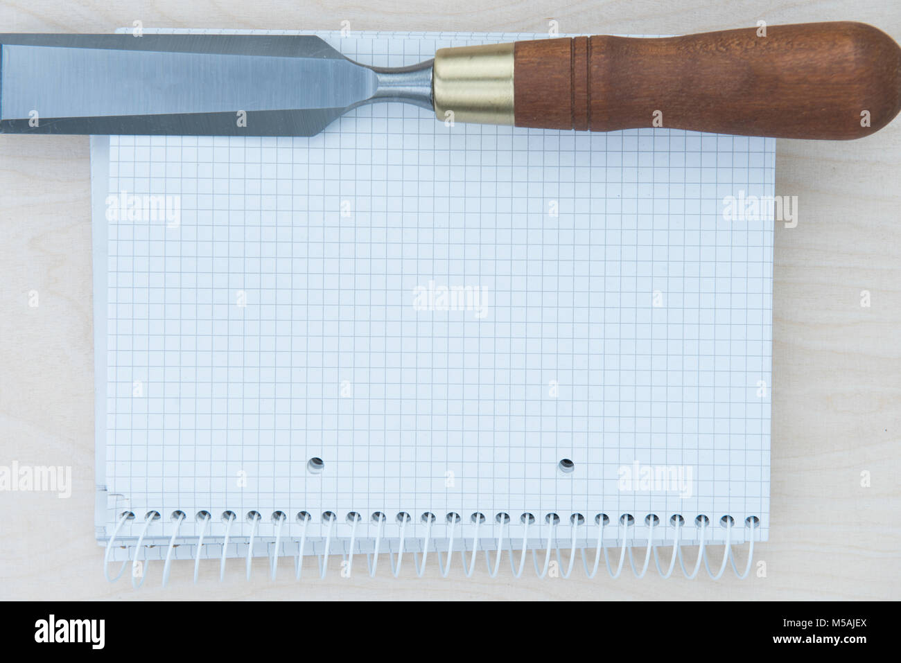 A professional chisel on a wooden background, with room for text Stock ...