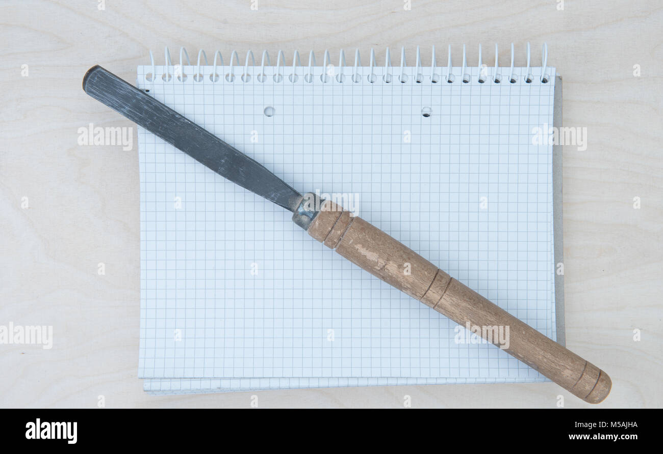 A professional chisel on a wooden background, with room for text Stock ...