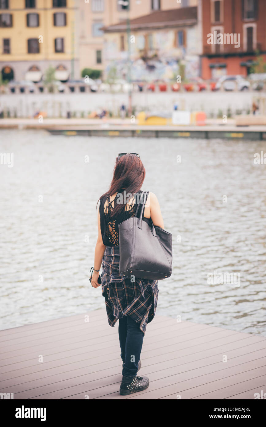 Back view beautiful young woman looking away thinking future - girl ...