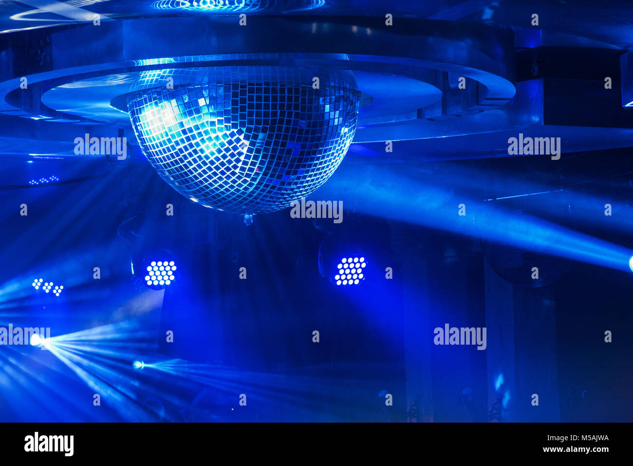 Disco ball with bright rays, night party or concert background Stock ...