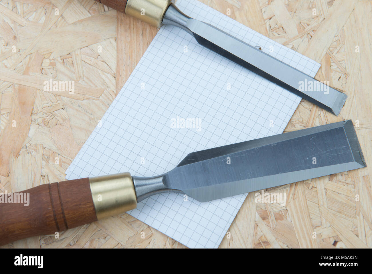A professional chisel on a wooden background, with room for text Stock ...