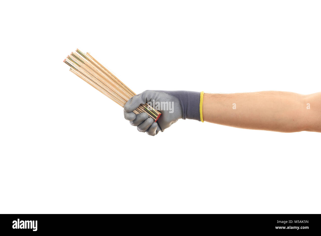 Gloved hand holding a wooden foldable meter on white background Stock ...