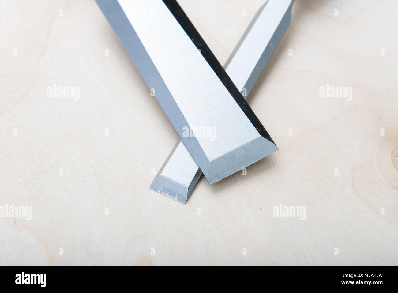 A professional chisel on a wooden background, with room for text Stock ...